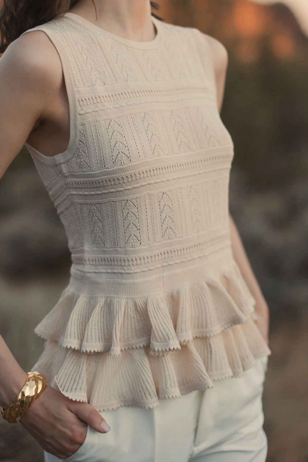 Beige Sleeveless High Neck Knit Top With Ruffle Hem | Mac Duggal